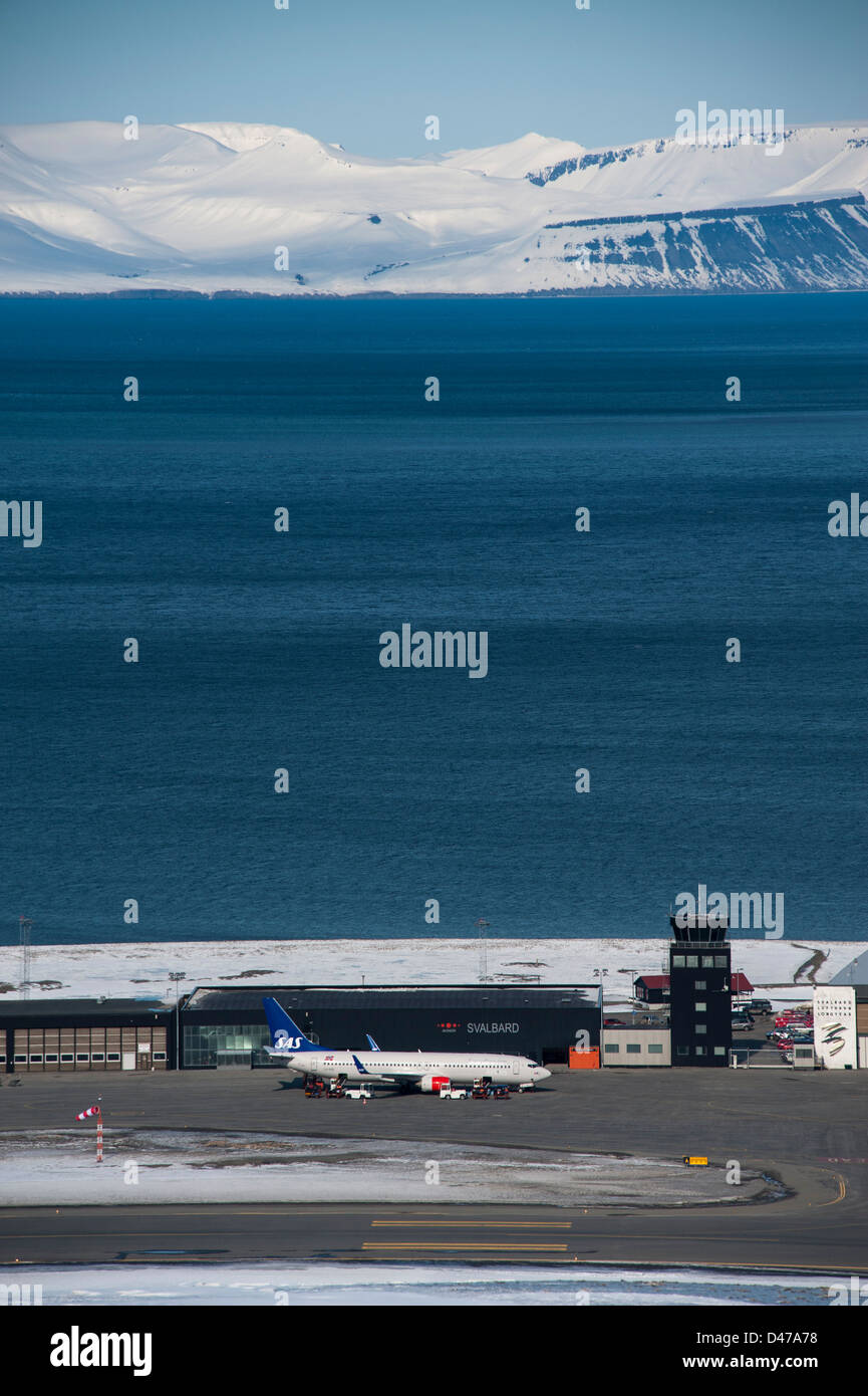 A SAS airplane on the tarmac at Svalbard Airport Longyear terminal with ...