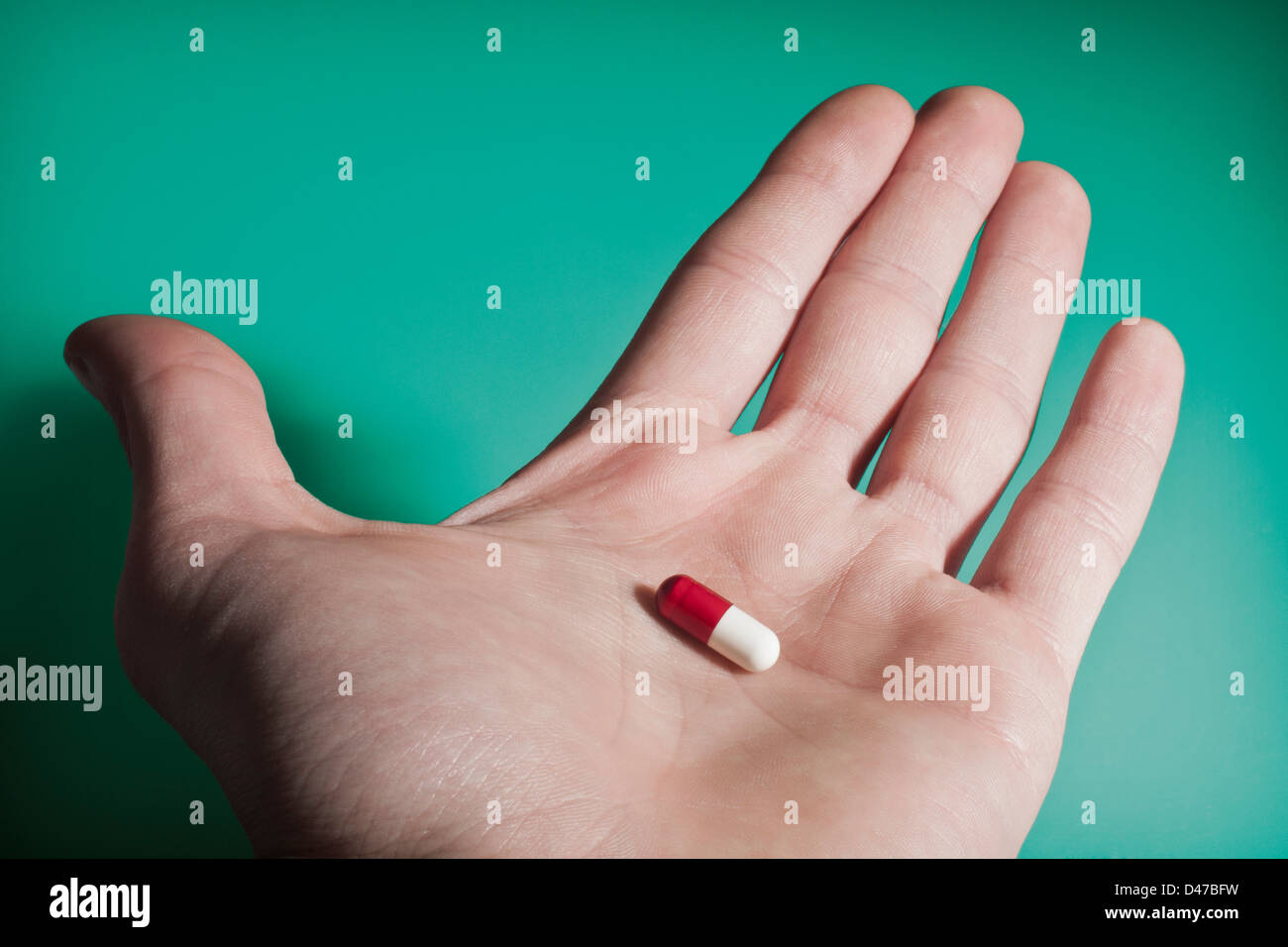 Capsule on hand Stock Photo - Alamy