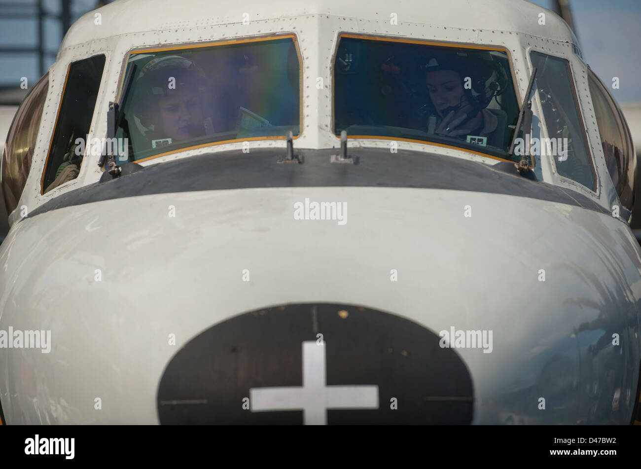 Sailors conduct pre-flight checks on aircraft aboard a U.S. Navy ship ...