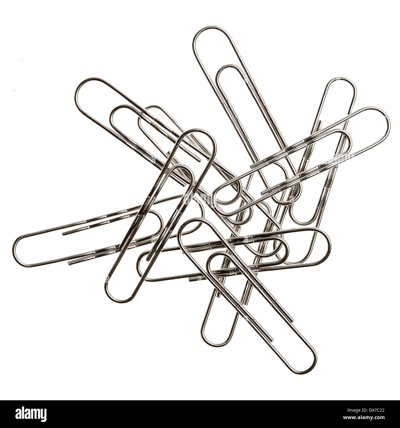 Small pile of large paper clips. Silver design on white background ...