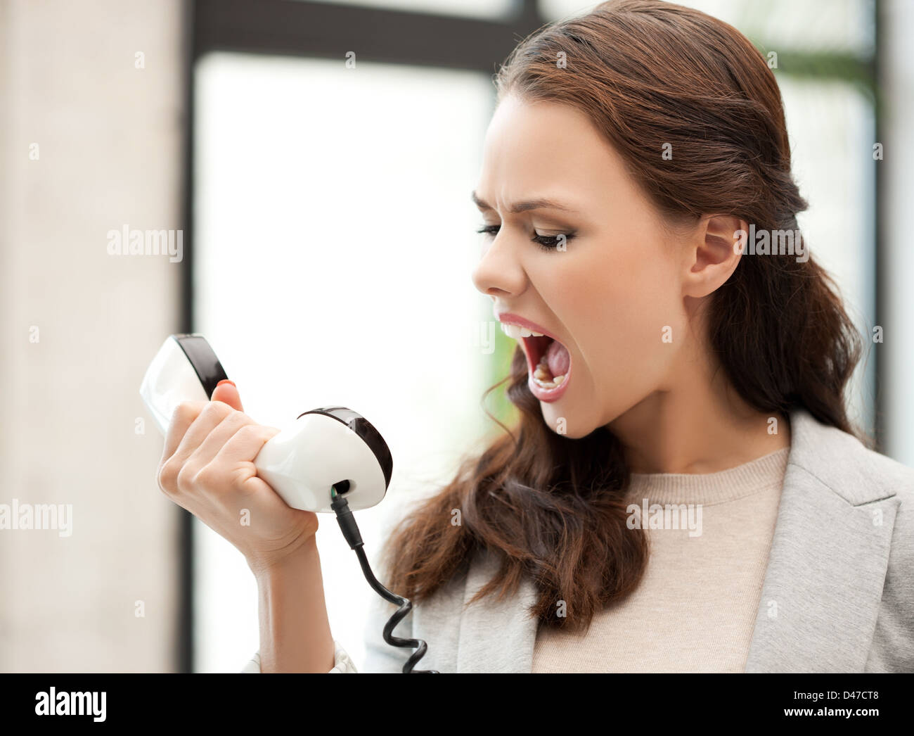 angry businesswoman shouting at phone Stock Photo - Alamy