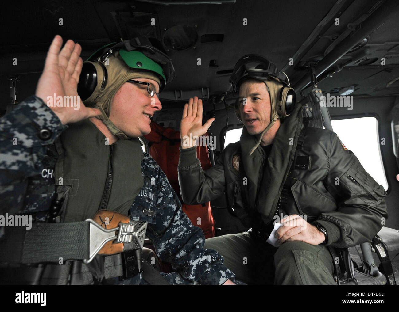 A Sailor takes the oath of enlistment aboard a Sea Hawk helicopter in ...