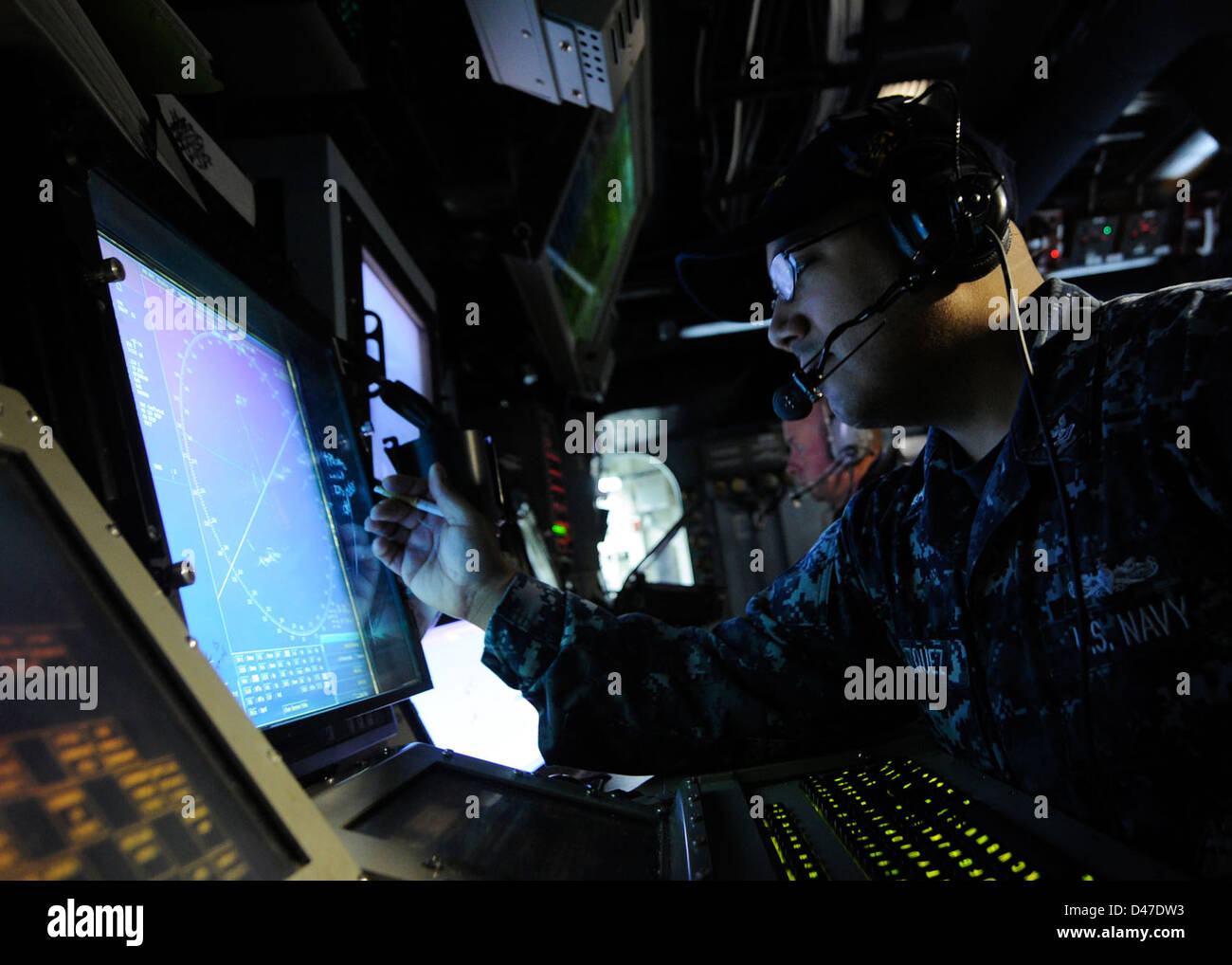 A Sailor monitors radar signals aboard USS Momsen Stock Photo - Alamy