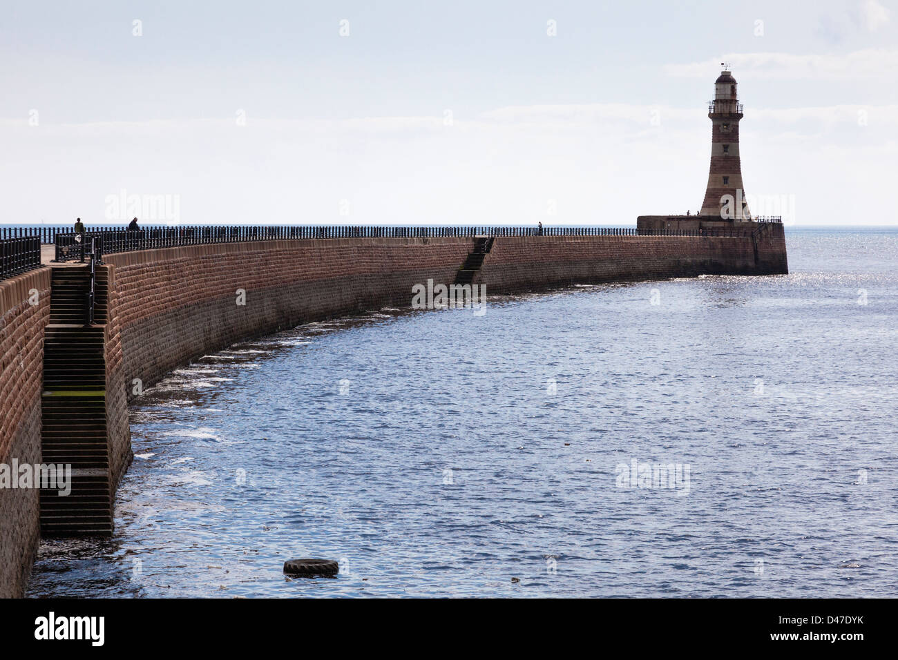 Anglers, lighthouse on the end of Roker pier, at the mouth of the River ...