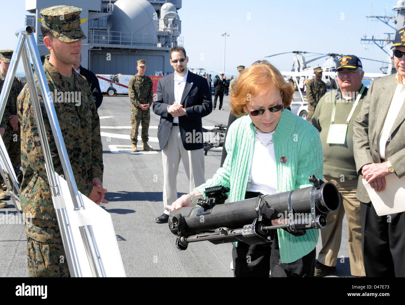 Former first lady Rosalynn Carter observes a Marine's rocket launcher ...