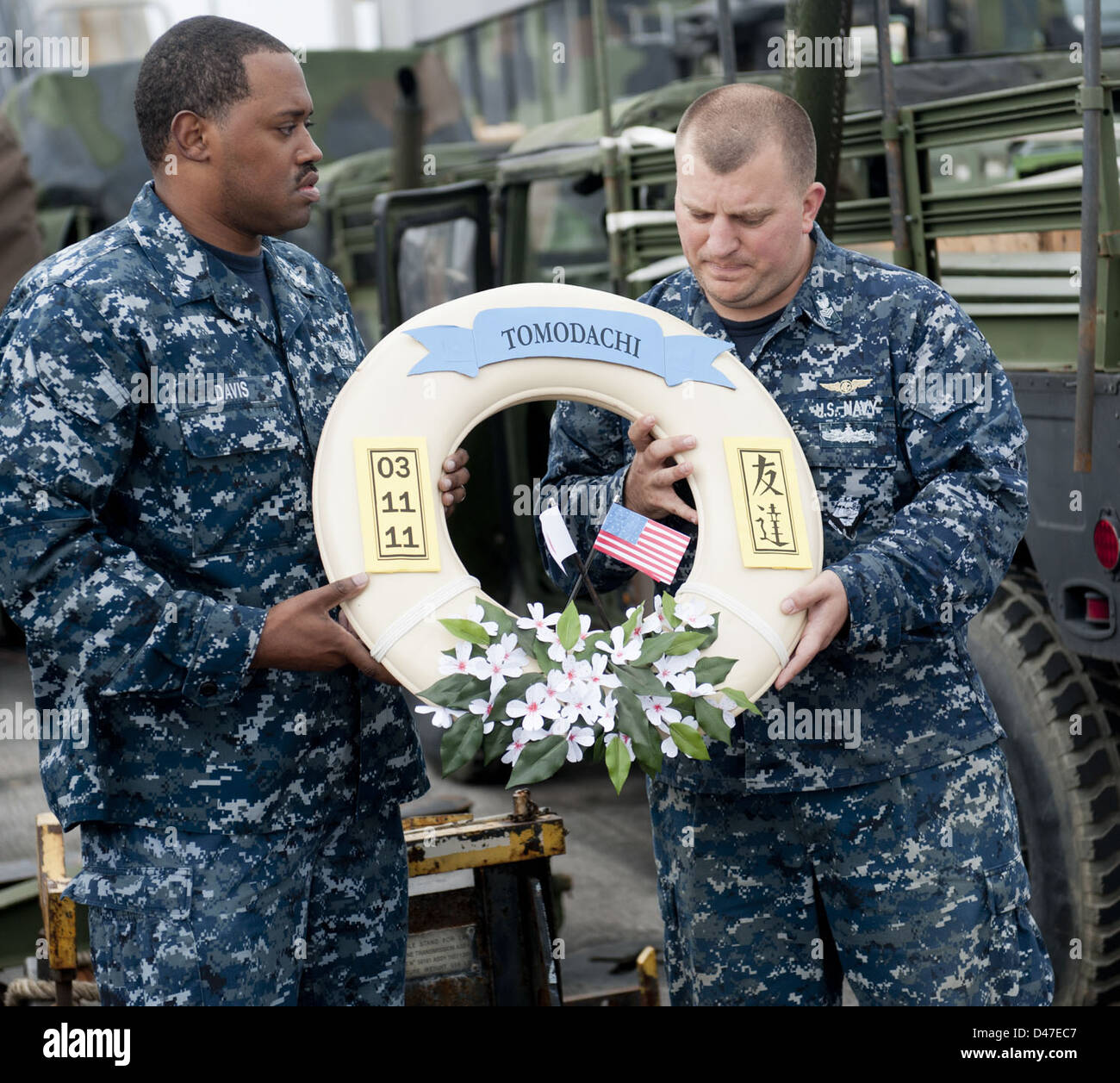 Sailors aboard the USS Tortuga conduct a ceremony in remembrance of ...