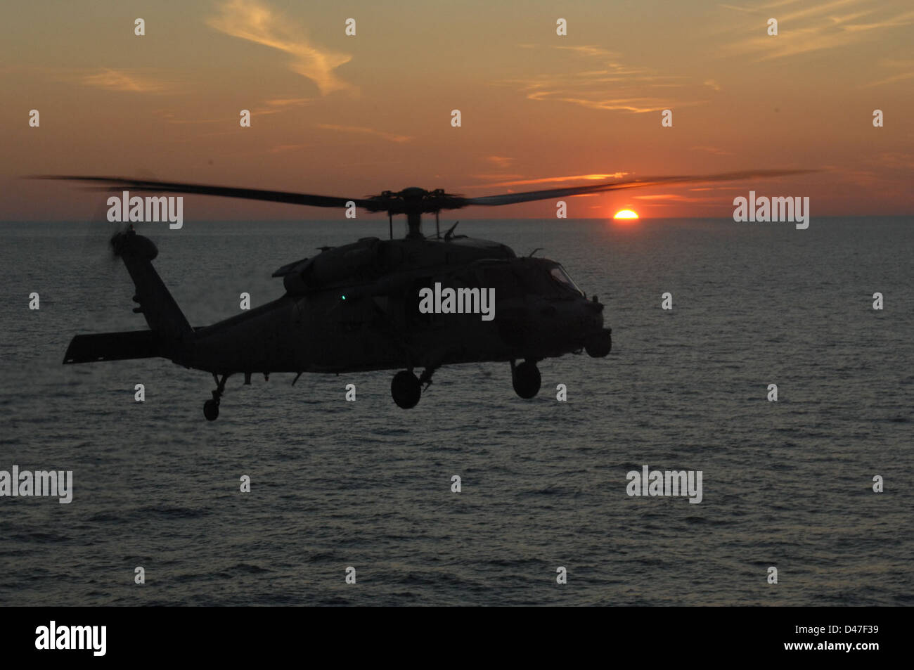 An MH-60S Sea Hawk helicopter conducts flight operations aboard the ...