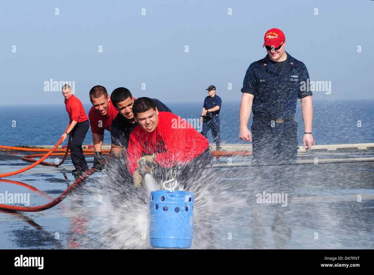 Members of the U.S. Navy's repair locker engage in the damage control ...