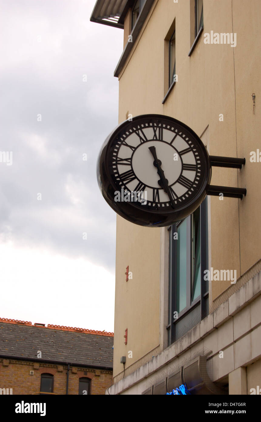 Clock on a wall in Greenwich, London, England Stock Photo - Alamy