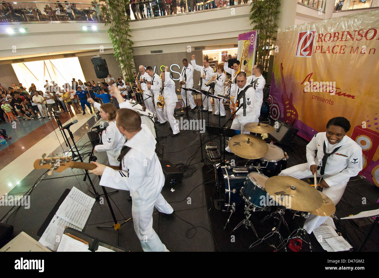 Members of the U.S. 7th Fleet Band perform for an audience of over ...