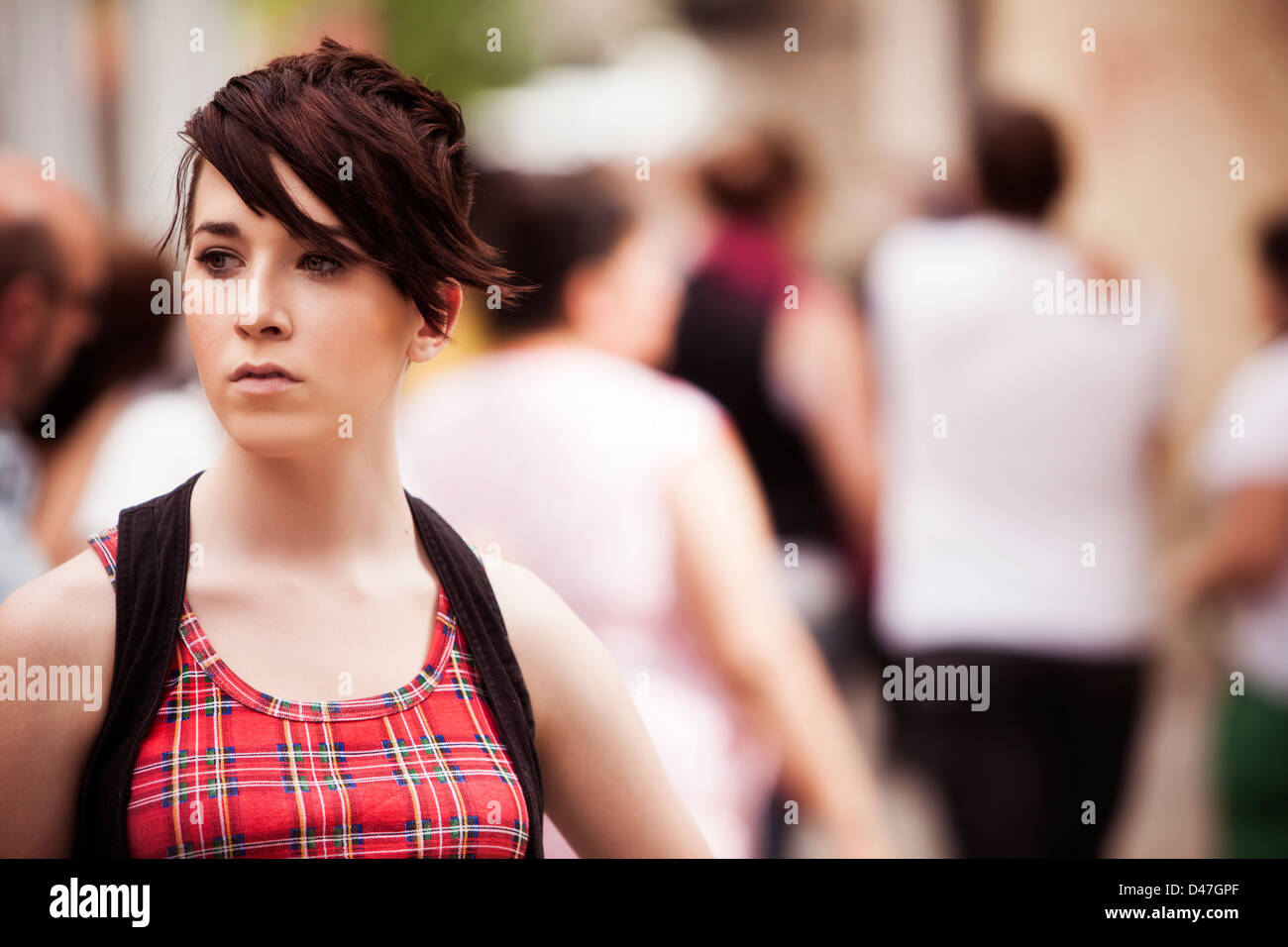 Young modern looking girl over urban background Stock Photo - Alamy