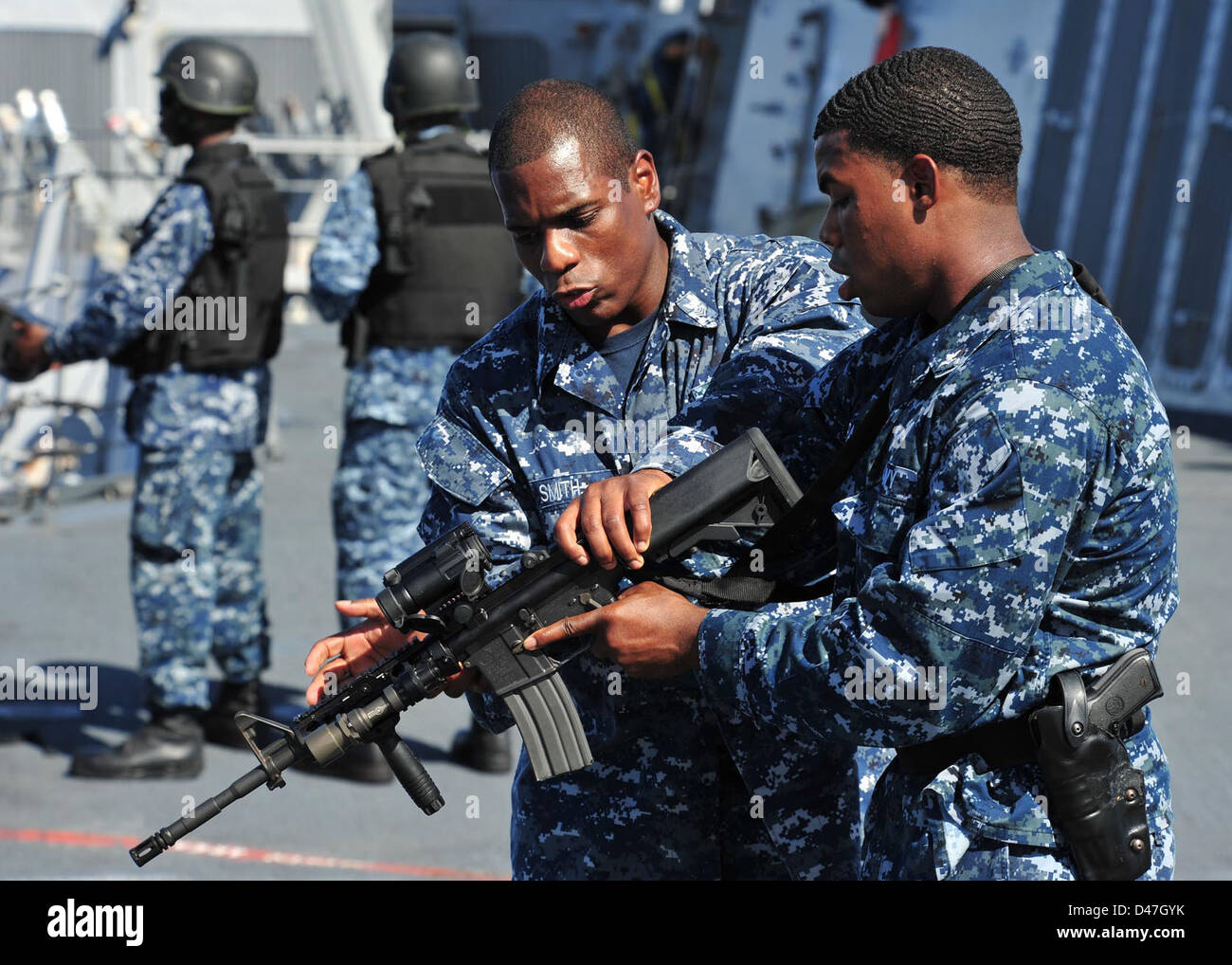 A Sailor gives weapons familiarization training Stock Photo - Alamy