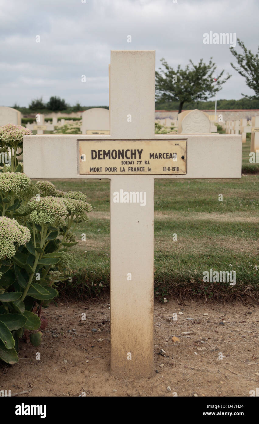 A typical Christian cross headstone in the French National Cemetery ...