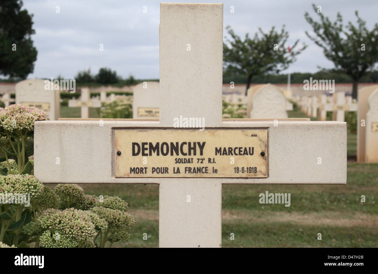 A typical Christian cross headstone in the French National Cemetery ...