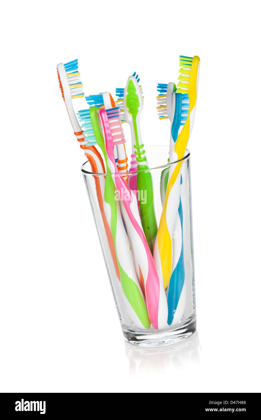 Colorful toothbrushes in glass. Isolated on white background Stock ...