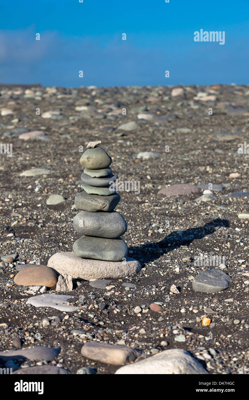 Pyramid from stones at volcanic beach, Iceland. Vertical shot Stock ...