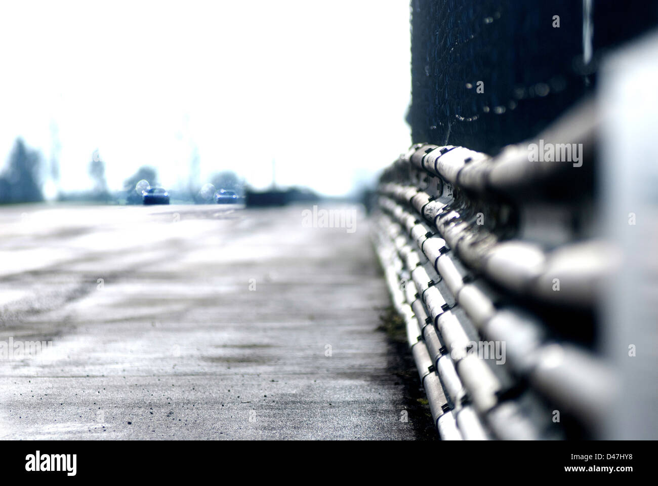 Crash barrier at Racing circuit Stock Photo - Alamy