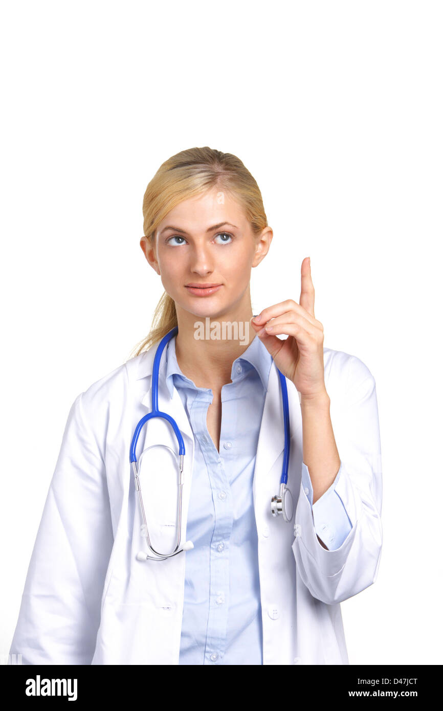 Woman doctor pointing in the studio Stock Photo - Alamy