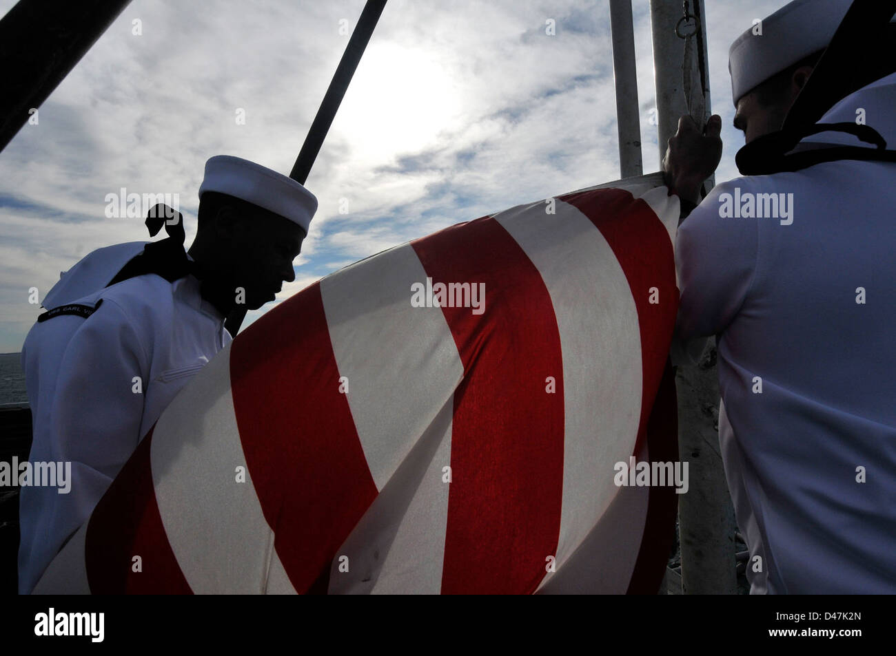Sailors aboard a U.S. Navy ship prepare to shift colors in Perth ...