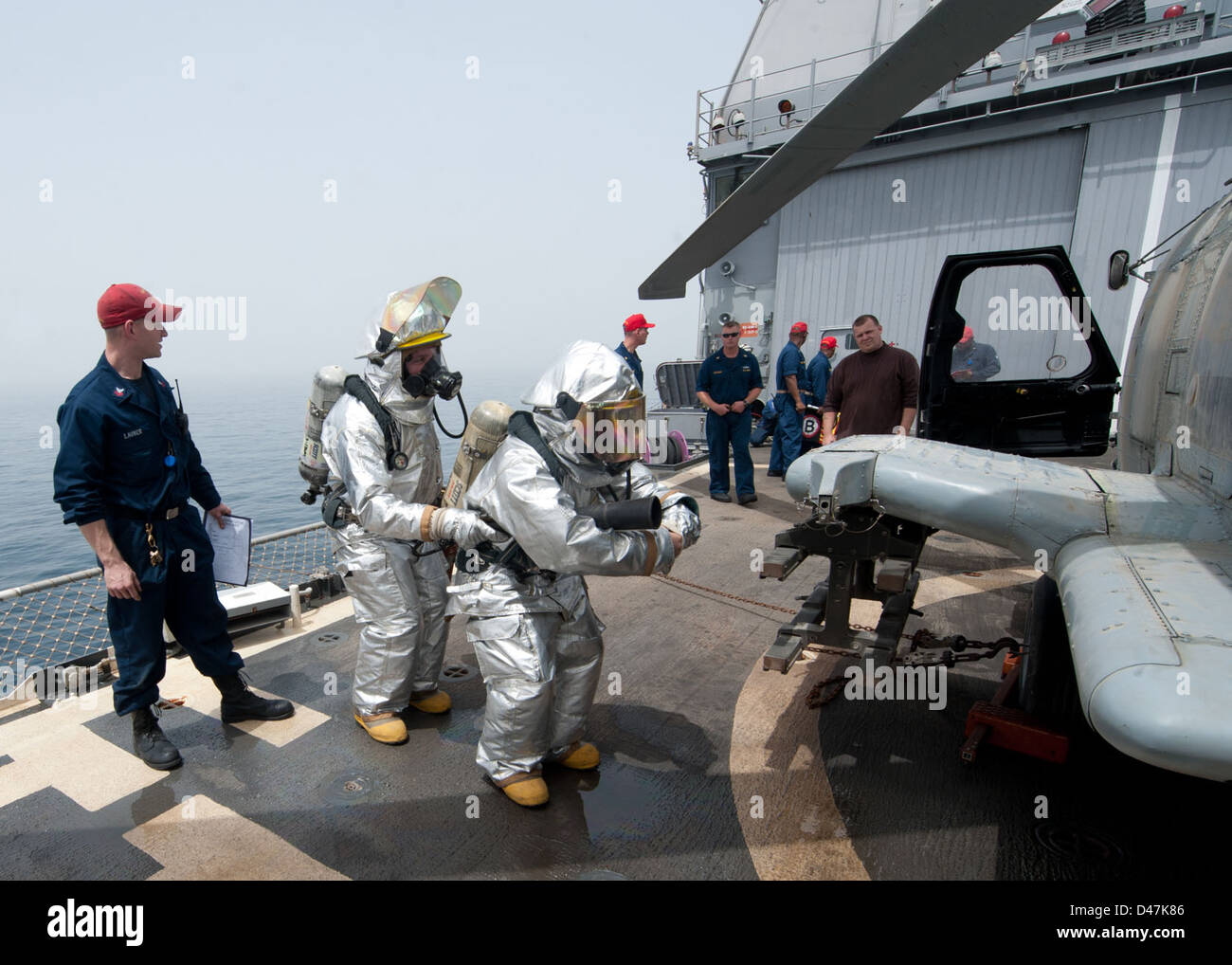 A Sailor on the USS Vicksburg leads a damage control drill in the ...