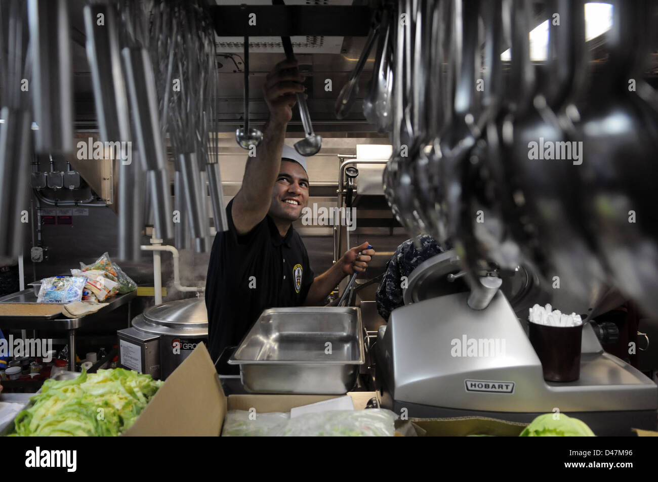 Cryptologic Technician (Technical) Seaman Jake Hale works in the galley ...