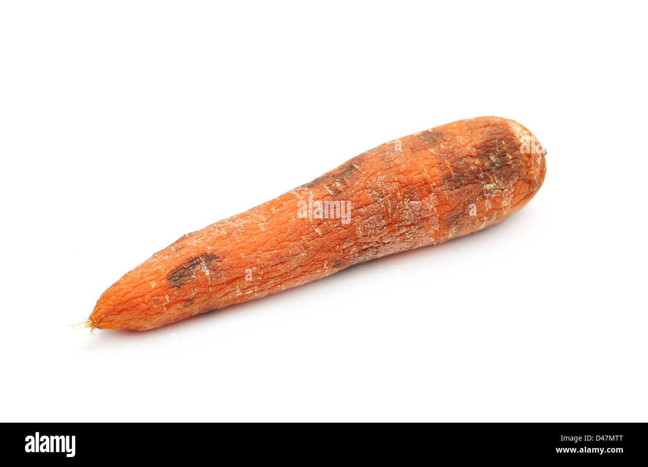 Old carrot isolated Stock Photo - Alamy