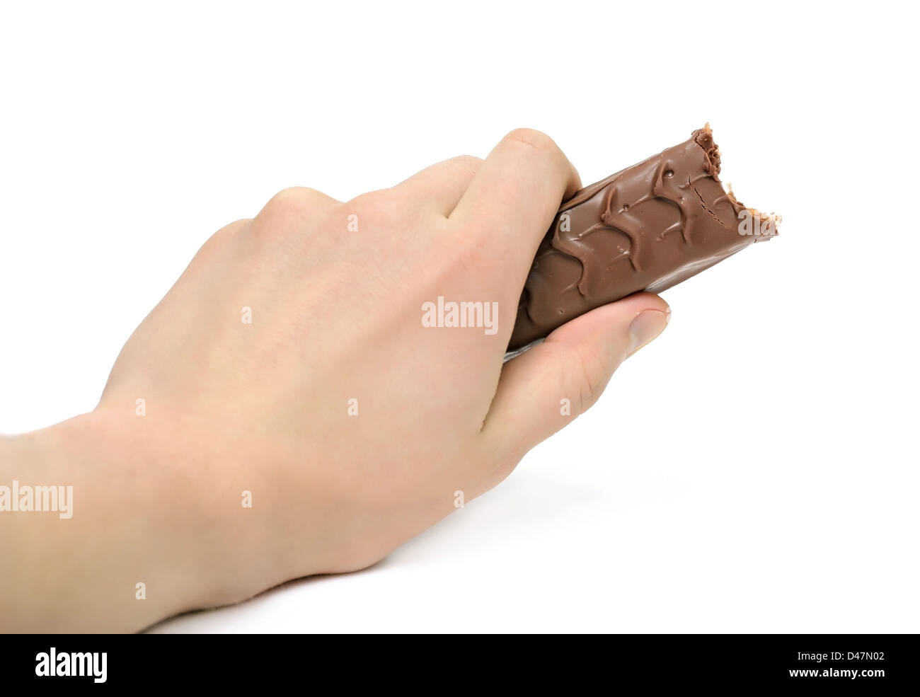 Chocolate bar in the hand isolated Stock Photo - Alamy