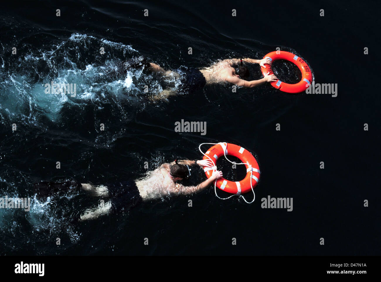 Sailors jump off aircraft elevator hi-res stock photography and images ...
