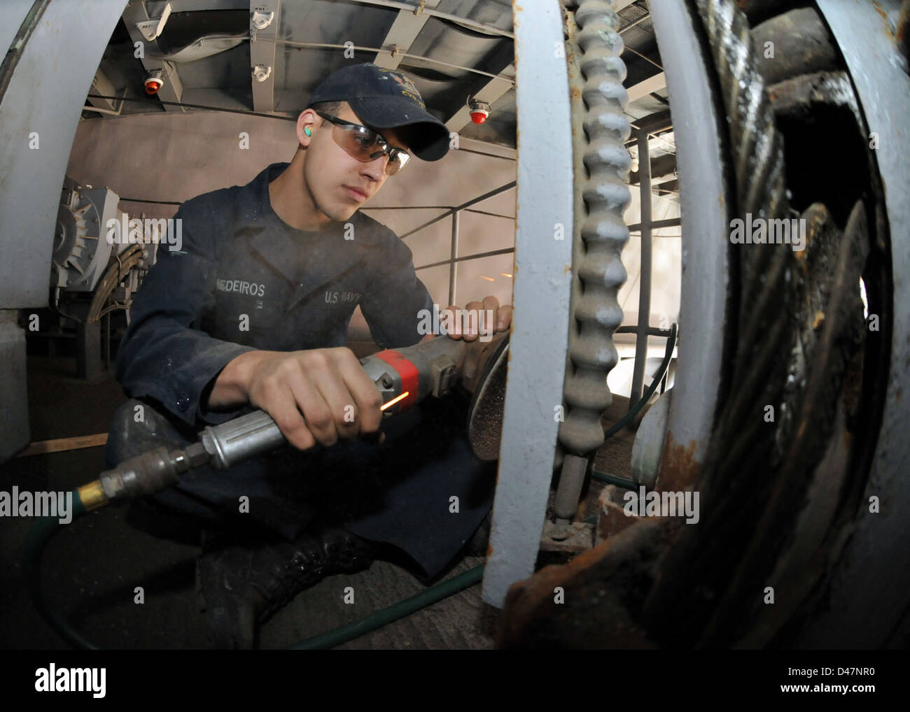 Seaman Bruce Medeiros operates a wench aboard the USS George Washington ...