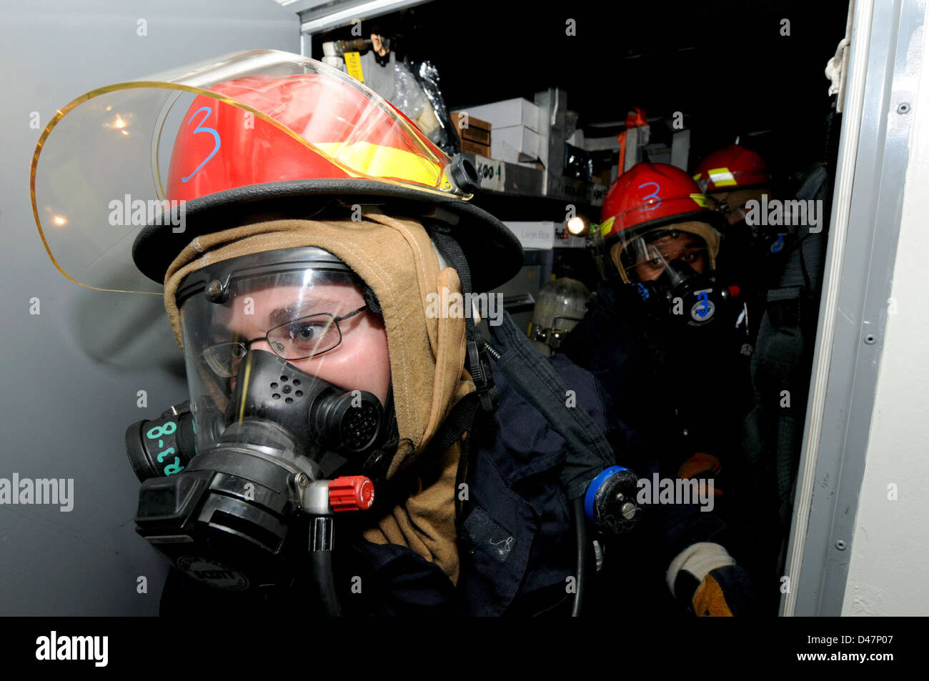 Sailors aboard a U.S. Navy ship conduct firefighting training in the ...