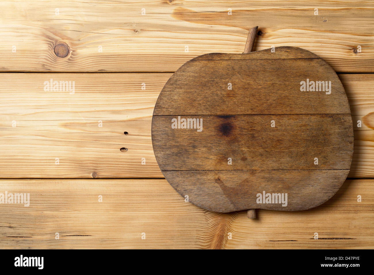 Old wooden apple on wood background with copy space, natural patterns ...