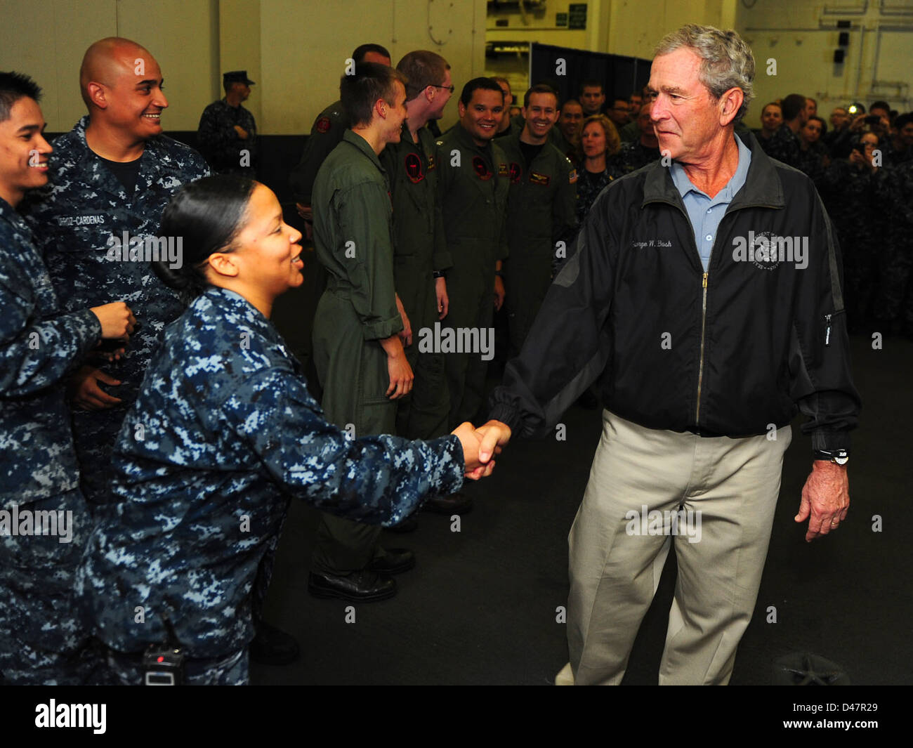 Former President George W. Bush meets with sailors aboard the USS ...