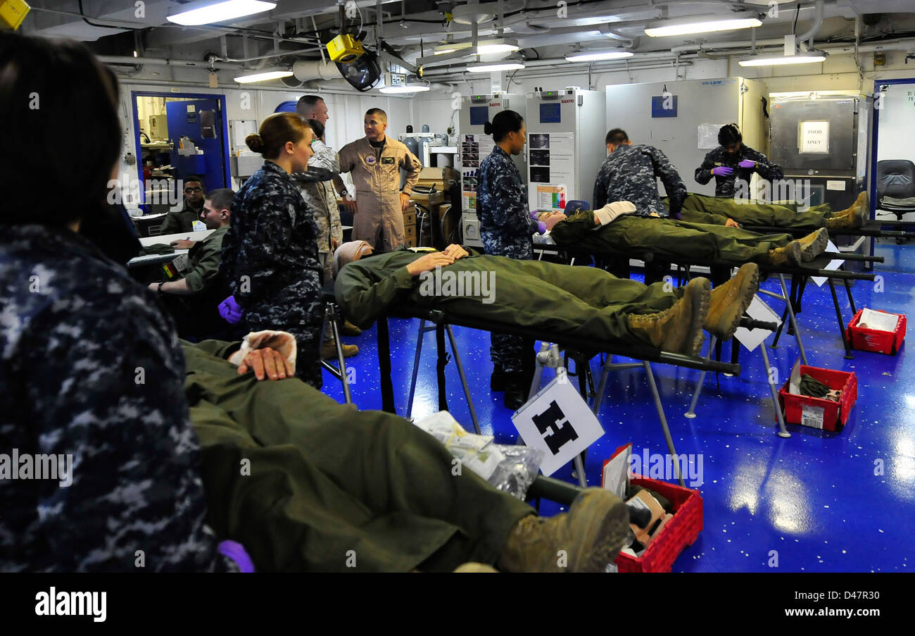 Hospital corpsmen monitor patients in a medical triage during a mass ...