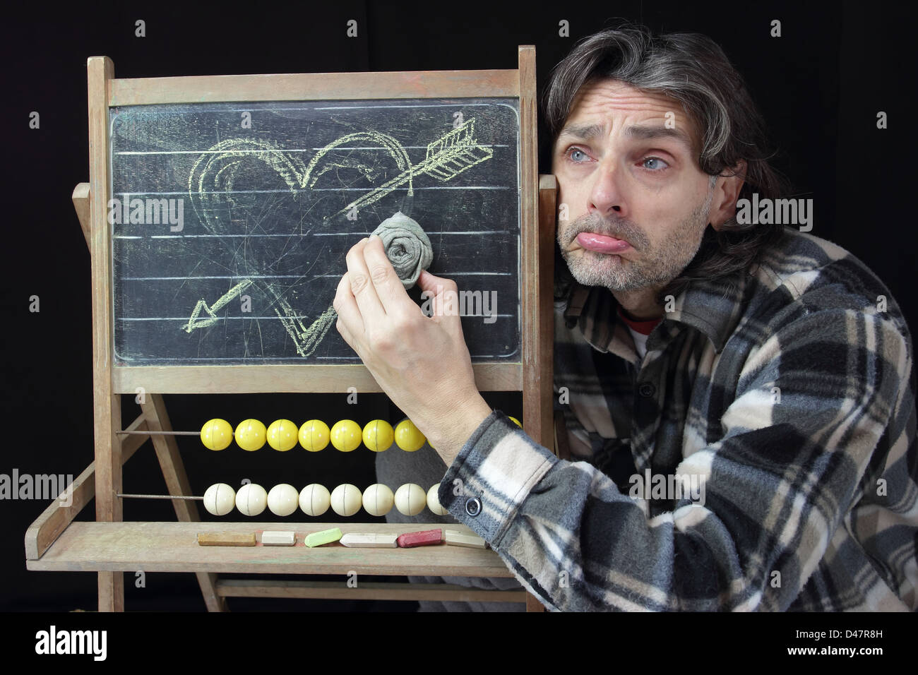 end of love concept,sad man erasing an heart sketch on chalkboard Stock ...
