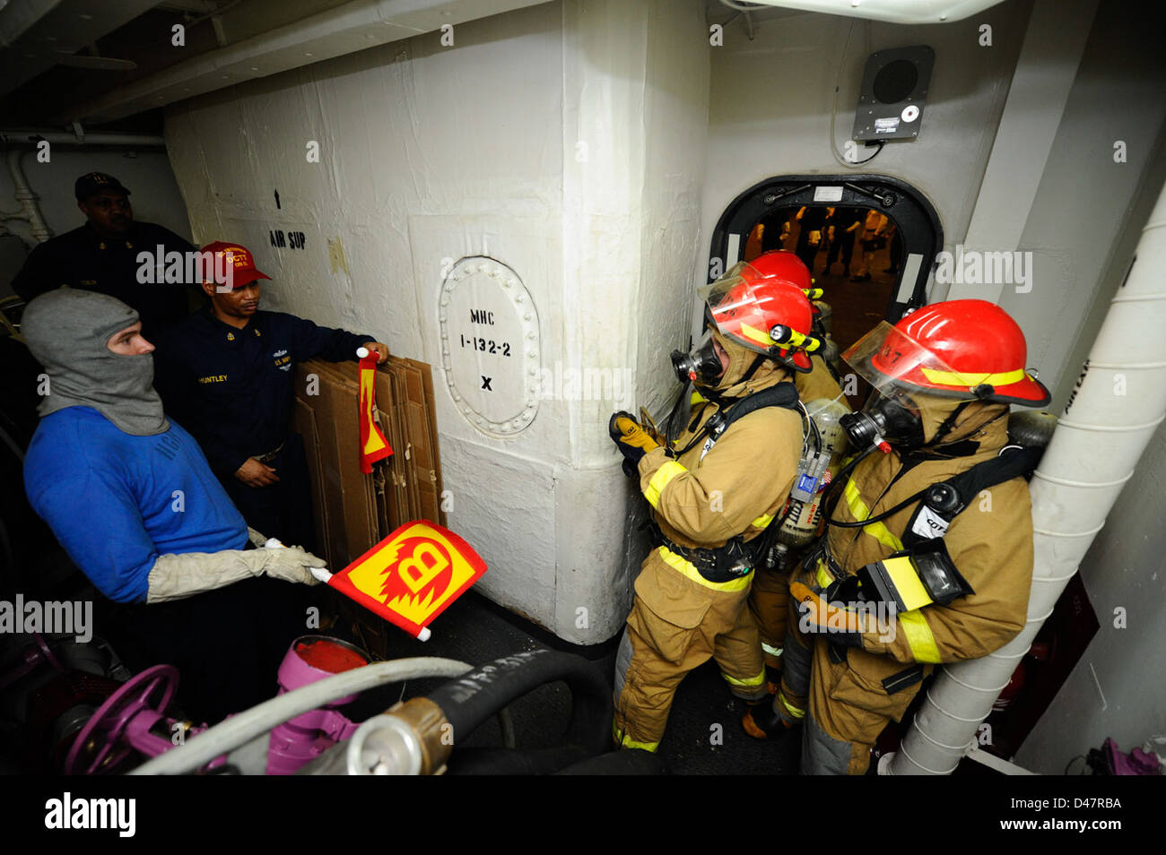Sailors aboard the aircraft carrier USS Enterprise practice damage ...
