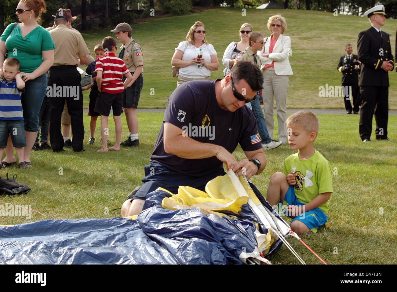 A U.S. Navy Leap Frog parachute demonstration team member demonstrates ...