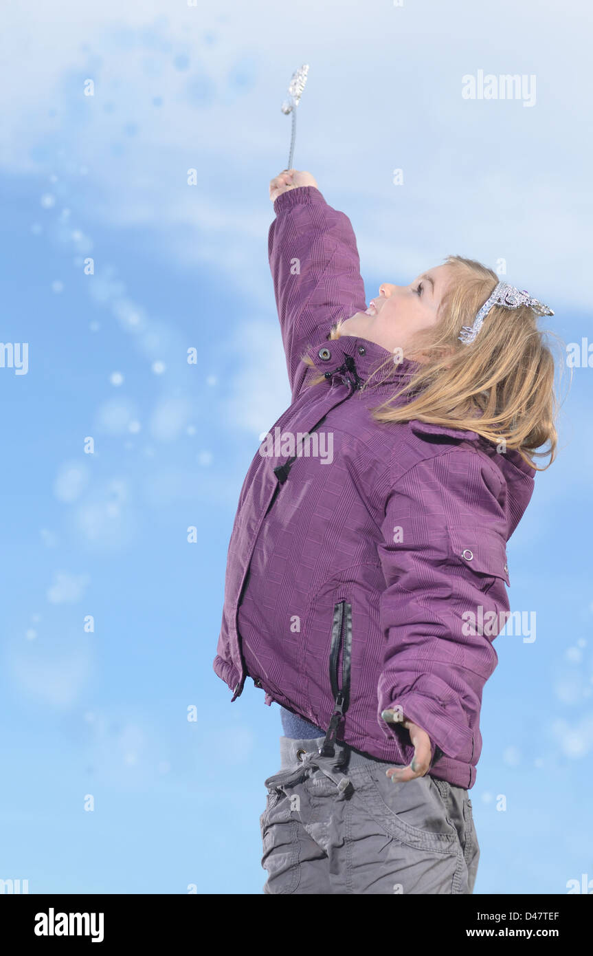 Girl child playing with a magic wand Stock Photo - Alamy
