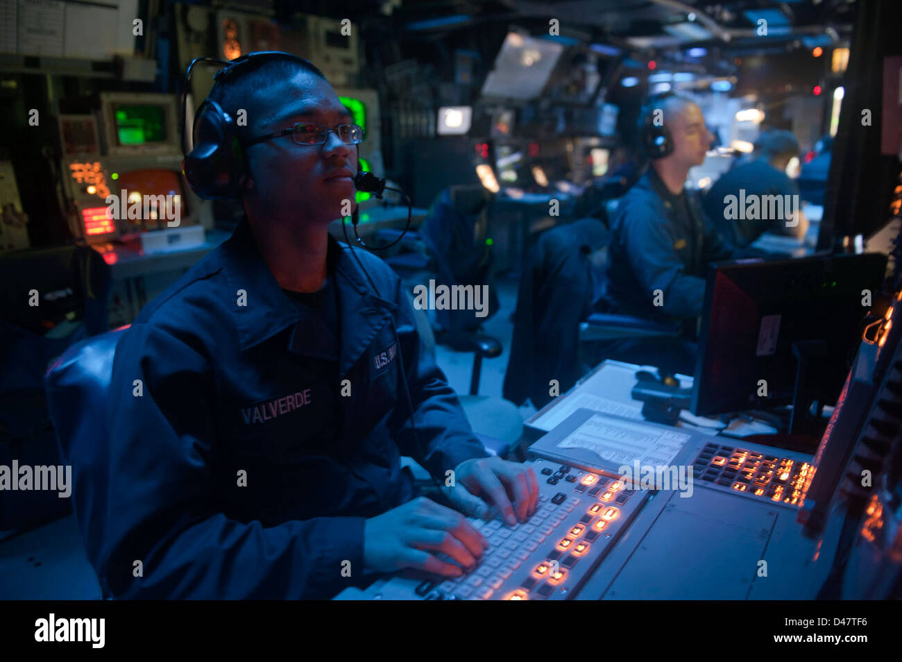 A Sailor mans a surface warfare supervisor console in the combat ...