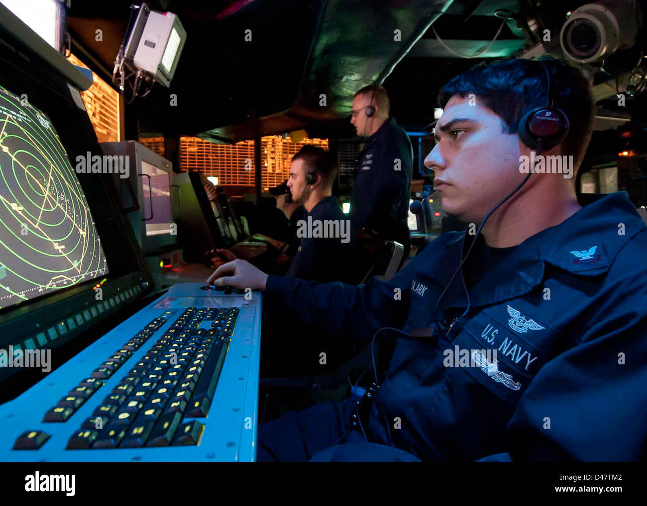 A Sailor monitors incoming aircraft movements from the air traffic ...