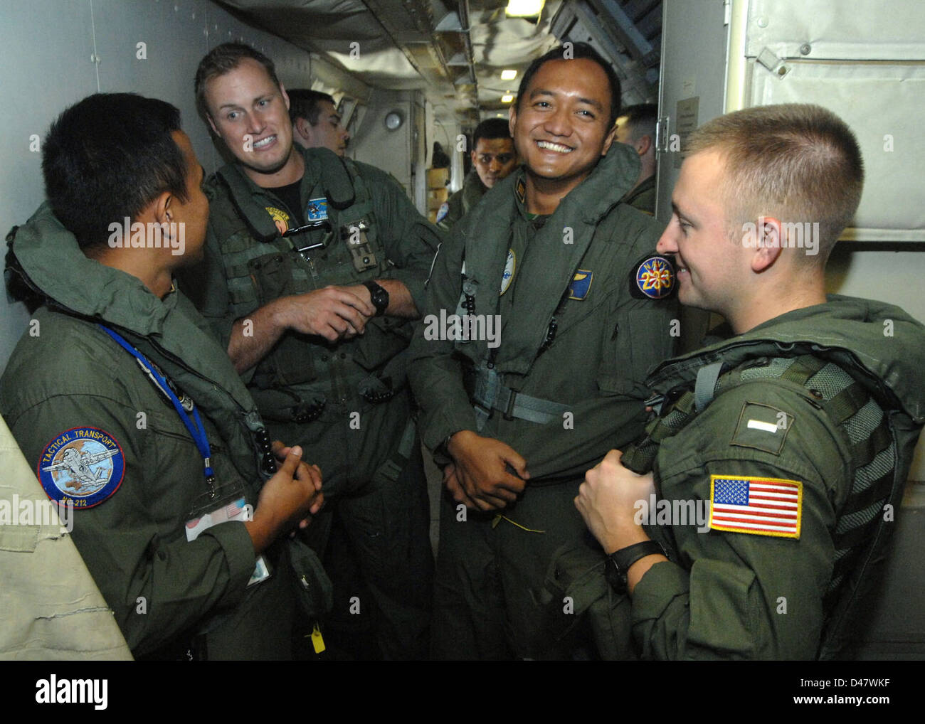 U.S. Navy Sailors participate in an orientation flight with Indonesian ...