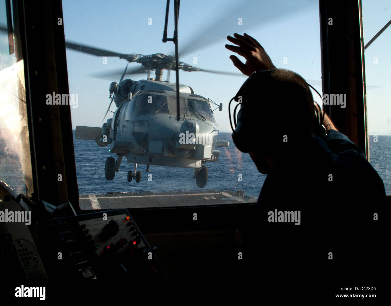 A helicopter is launched from the USS James E. Williams, supporting ...