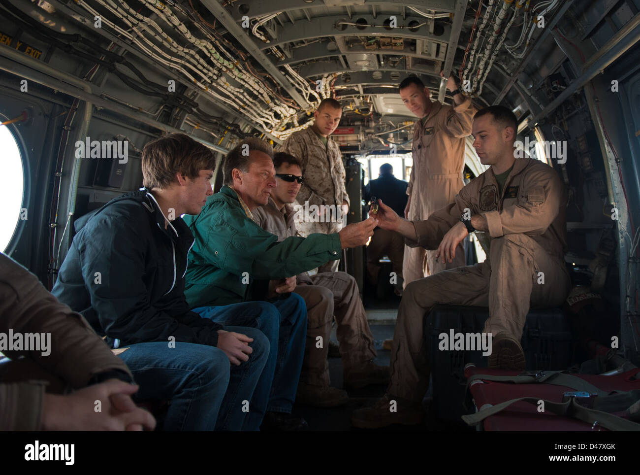 A Marine provides a tour to Tiger Cruise participants aboard the USS ...