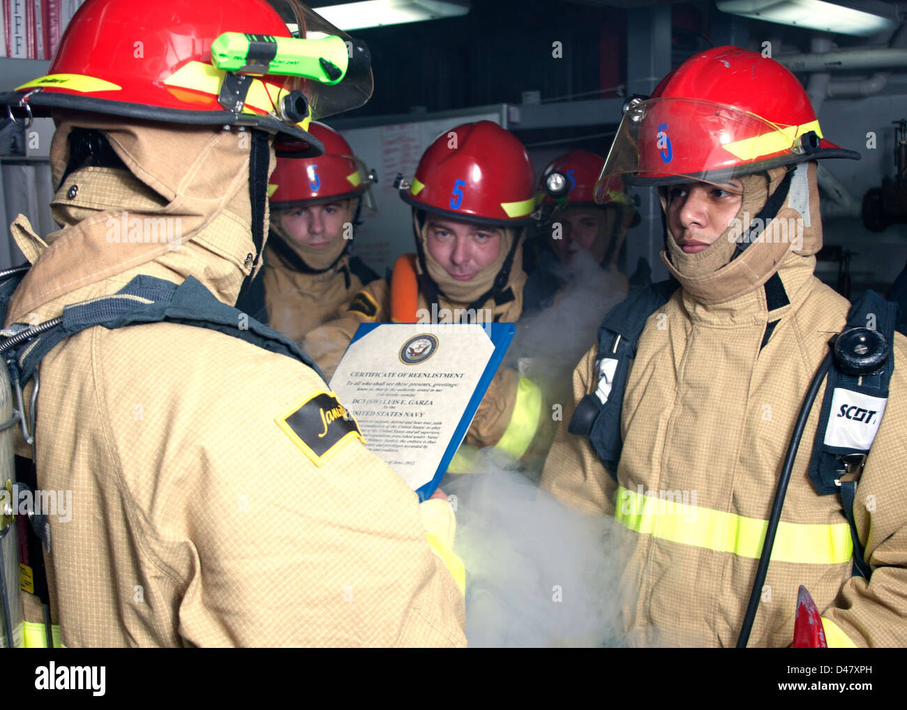 Sailors aboard the USS Enterprise (CVN 65) conduct a damage control ...