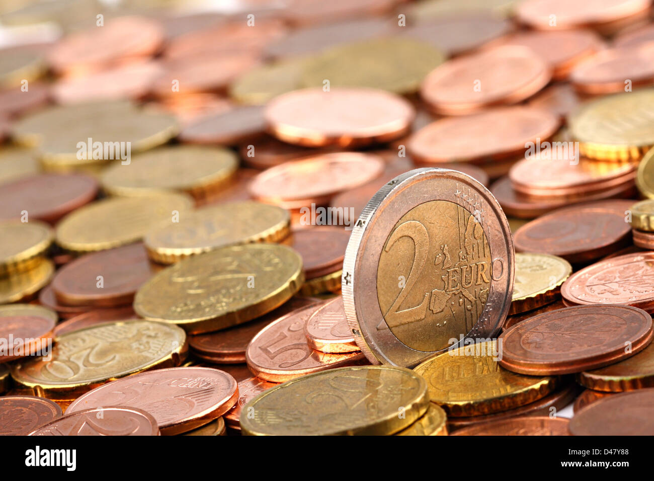 two EURO coin ina lot of EURO cent coins Stock Photo - Alamy