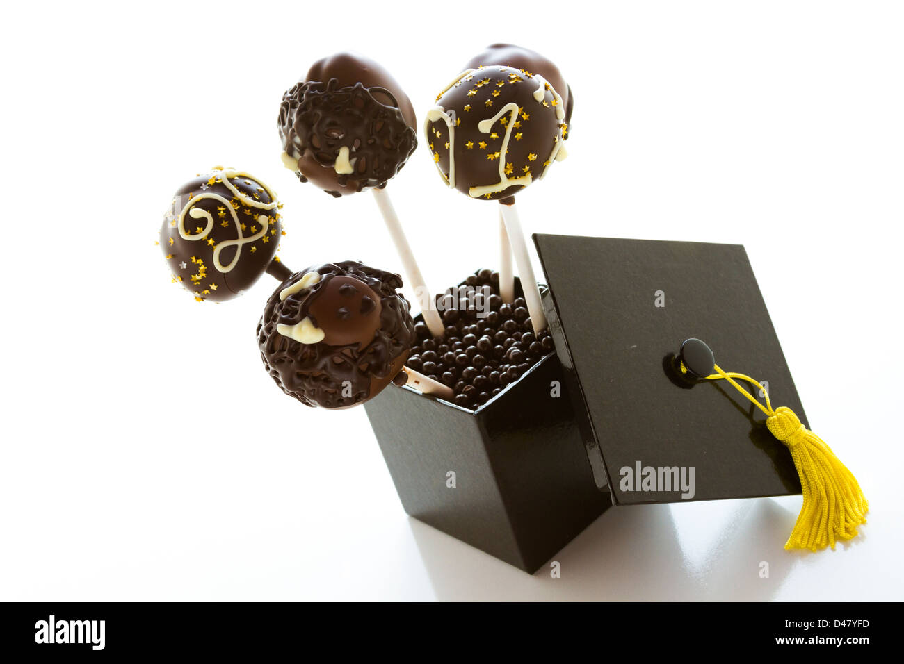 Gourmet chocolate cake pops decorated for graduation party Stock Photo ...