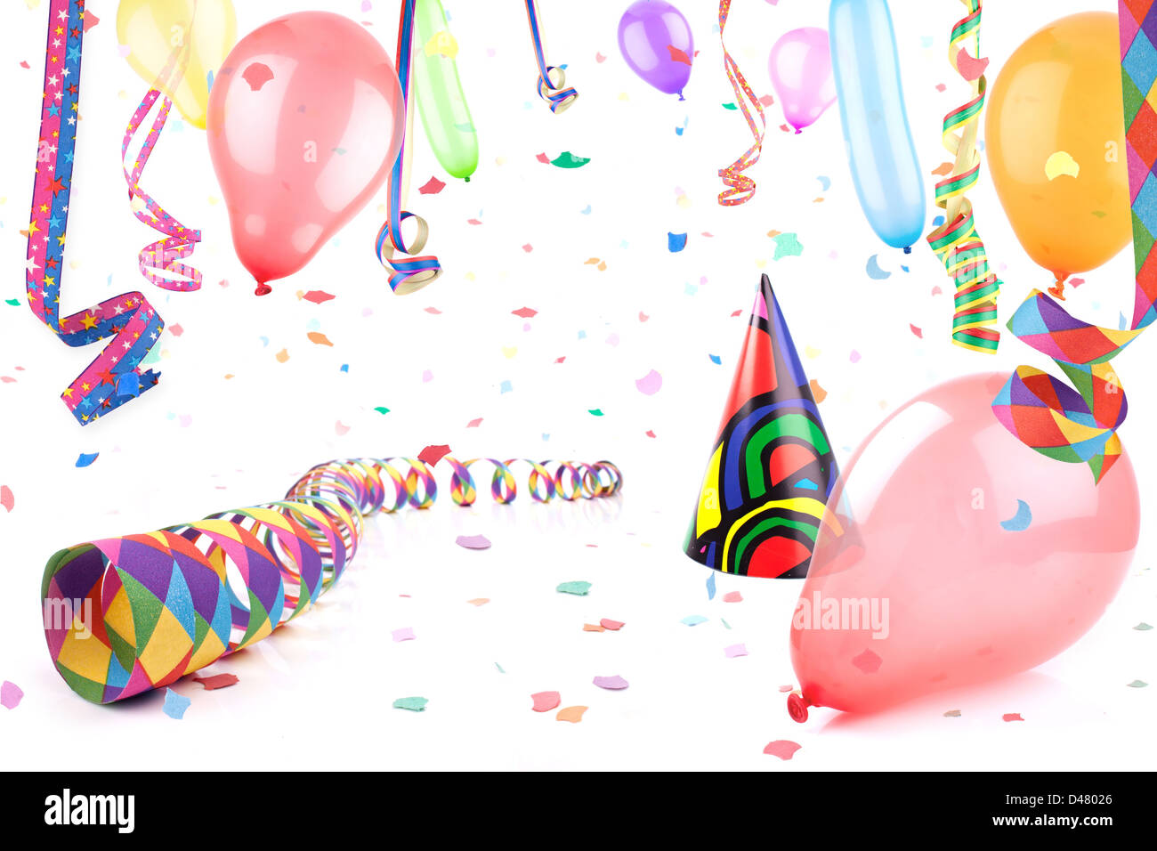Streamers,balloons and party hat in confetti rain Stock Photo - Alamy