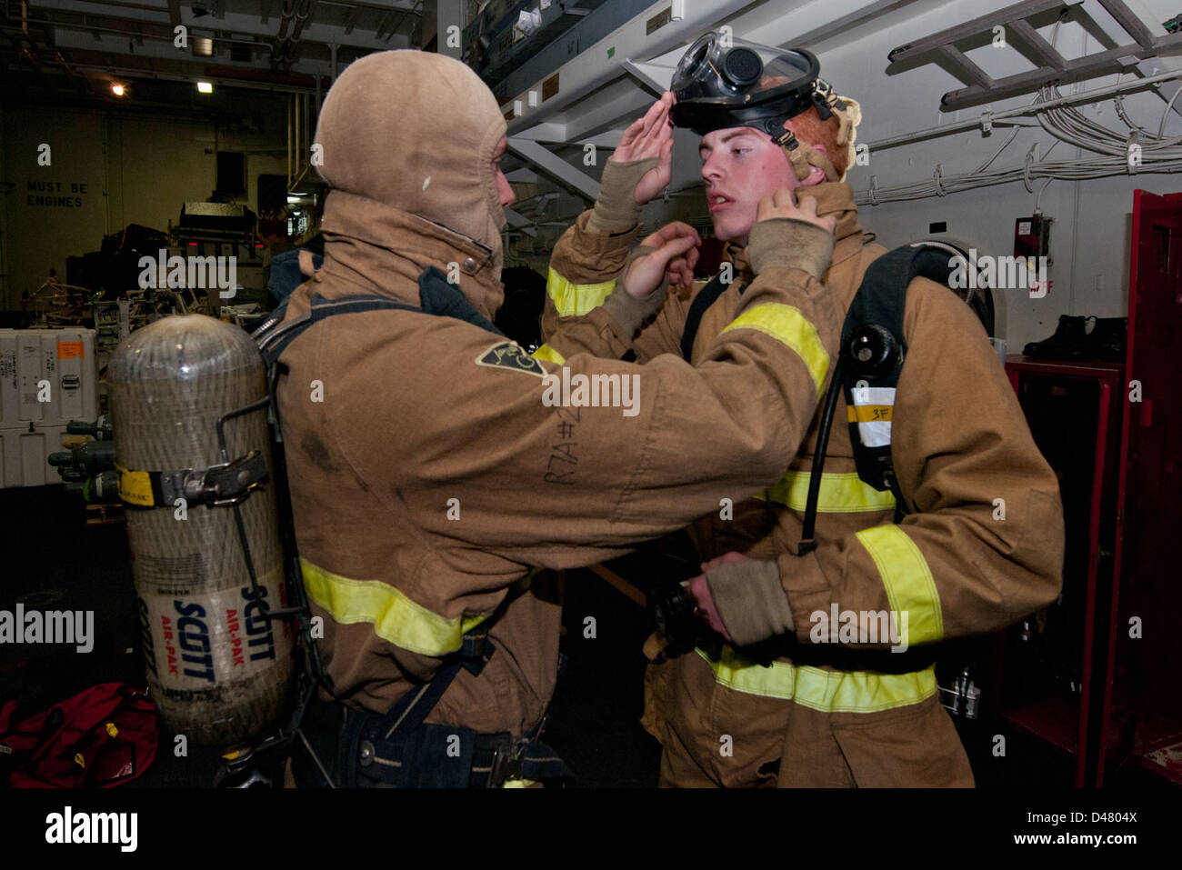 A Sailor prepares for a firefighting drill in the Pacific Ocean ...
