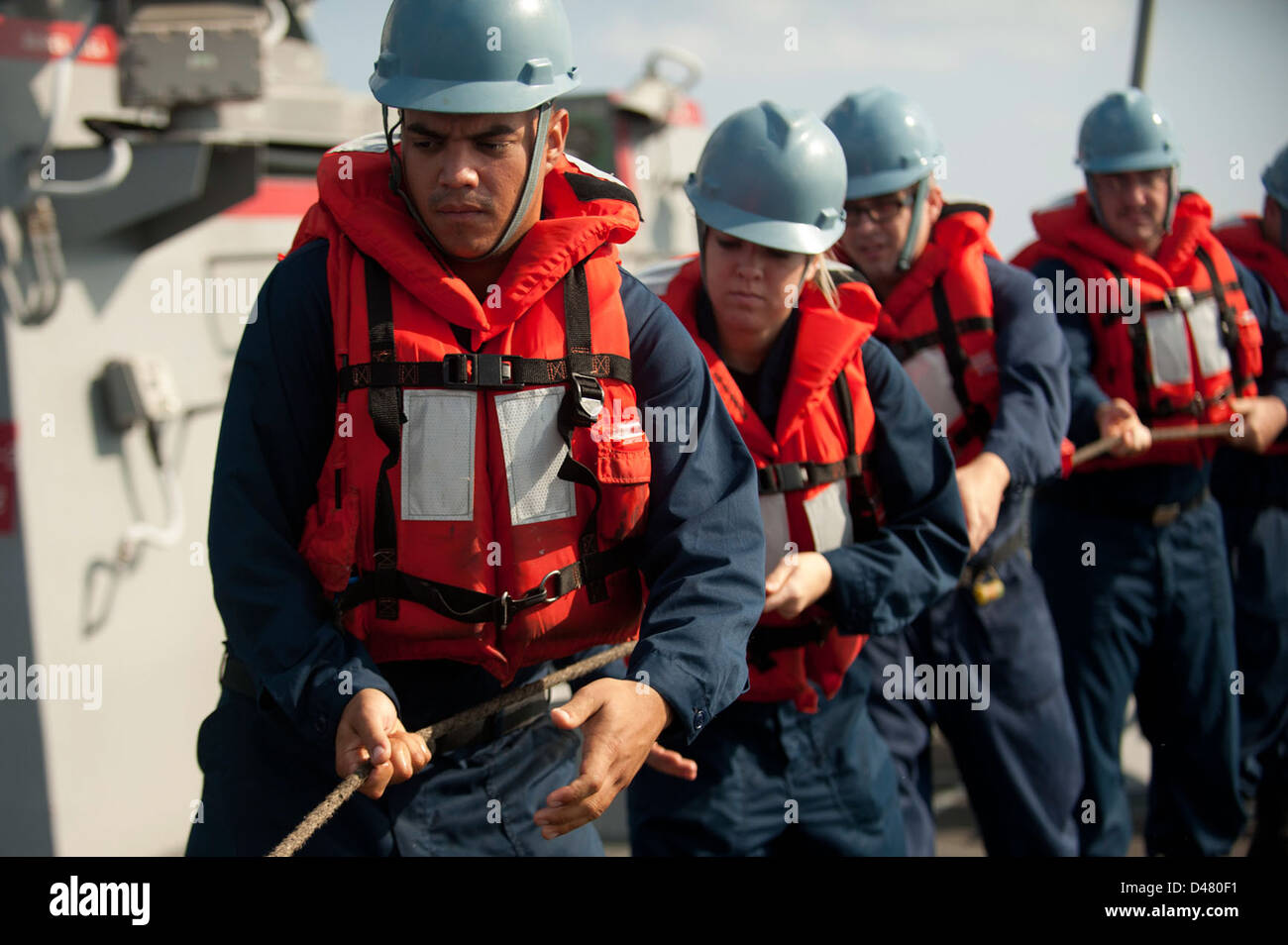 Sailors heave around the messenger line Stock Photo - Alamy