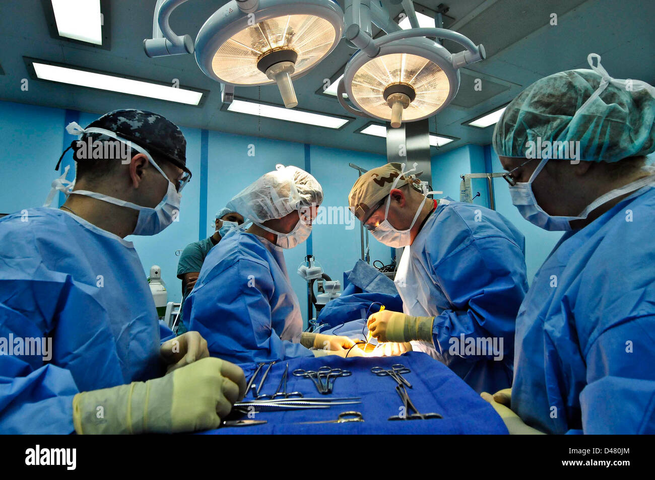 Doctors from the U.S. Navy, working aboard the USNS Mercy, provide ...