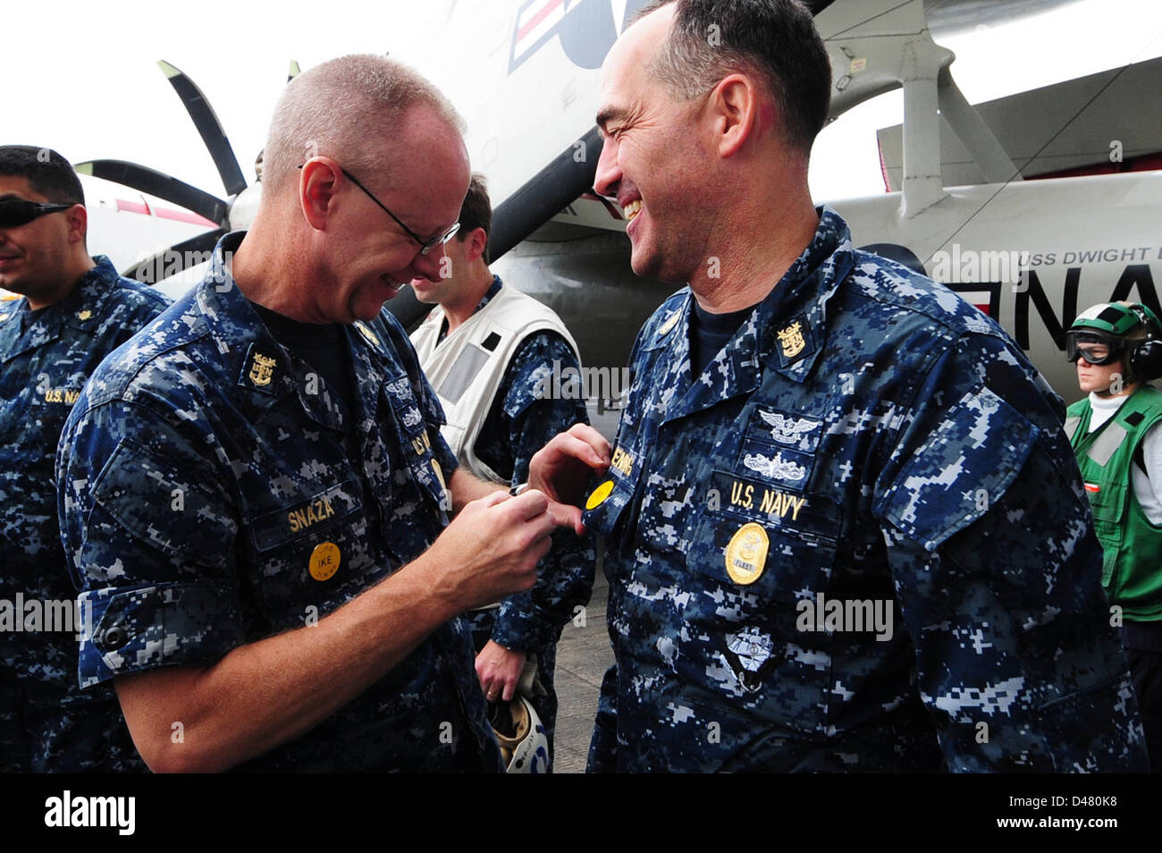 The Total Force Fleet Master Chief receives an 'I Like IKE' pin during ...